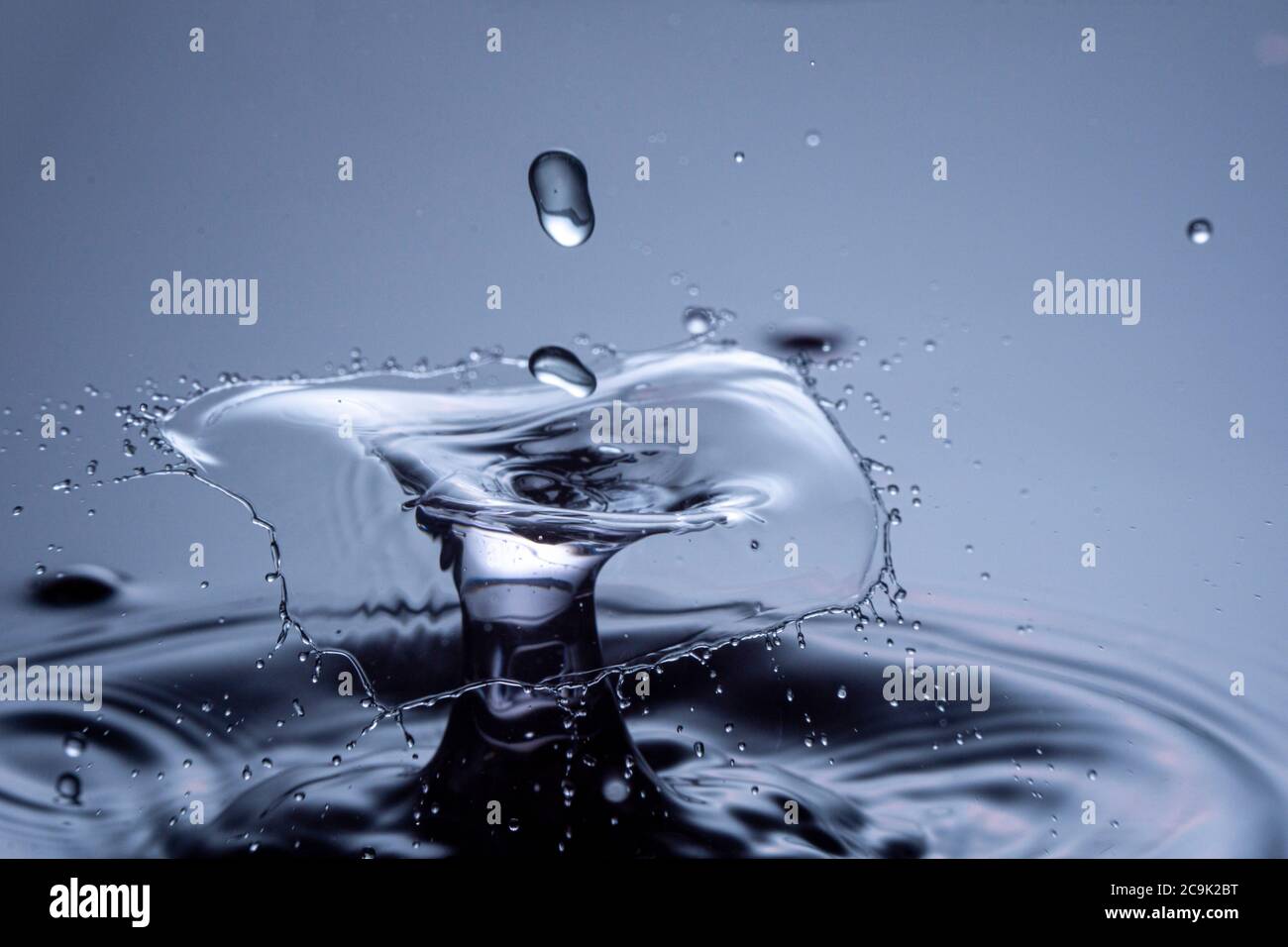 Water drop impact Stock Photo - Alamy