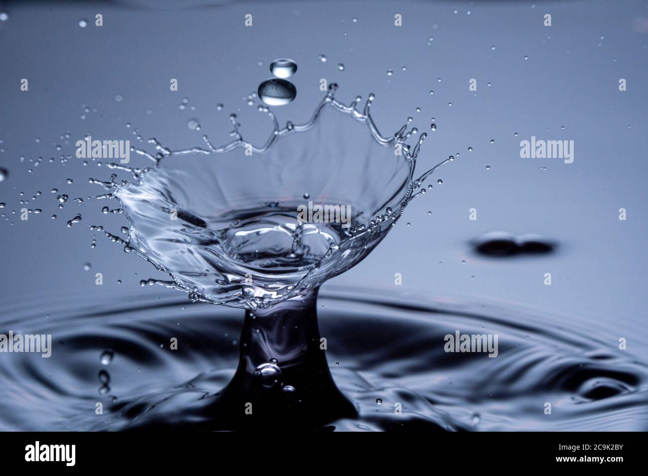 Water drop impact Stock Photo - Alamy