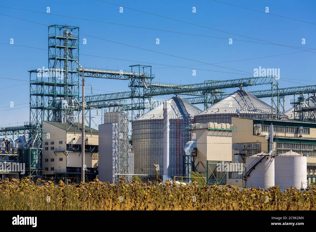 agricultural plant building with pipes and iron tanks for drying grain ...