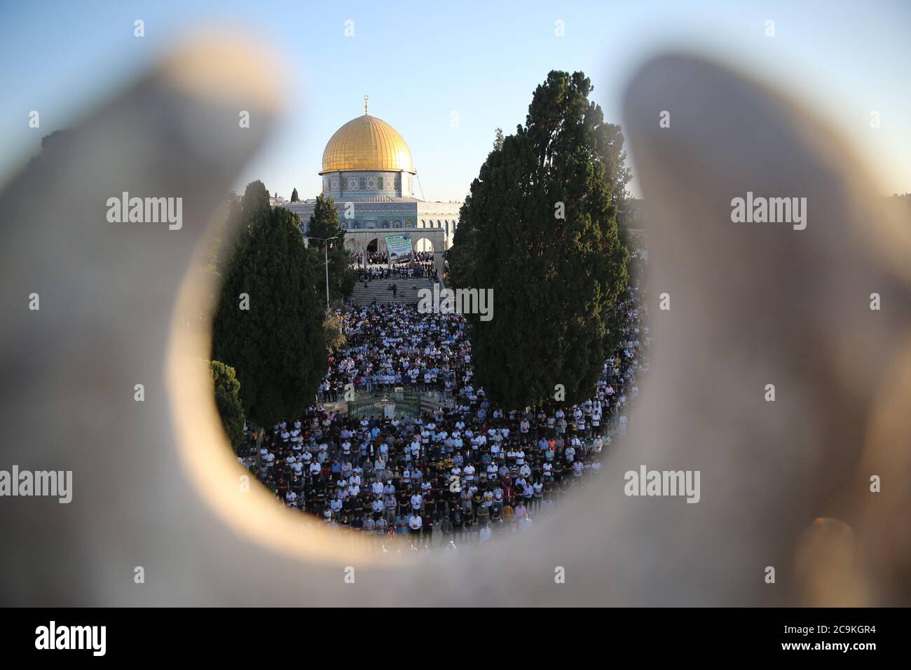 Beijing, China. 31st July, 2020. Muslim worshippers pray as they mark ...