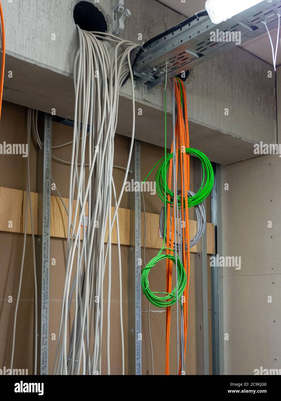 on a construction site many network and power cables hang from the ...