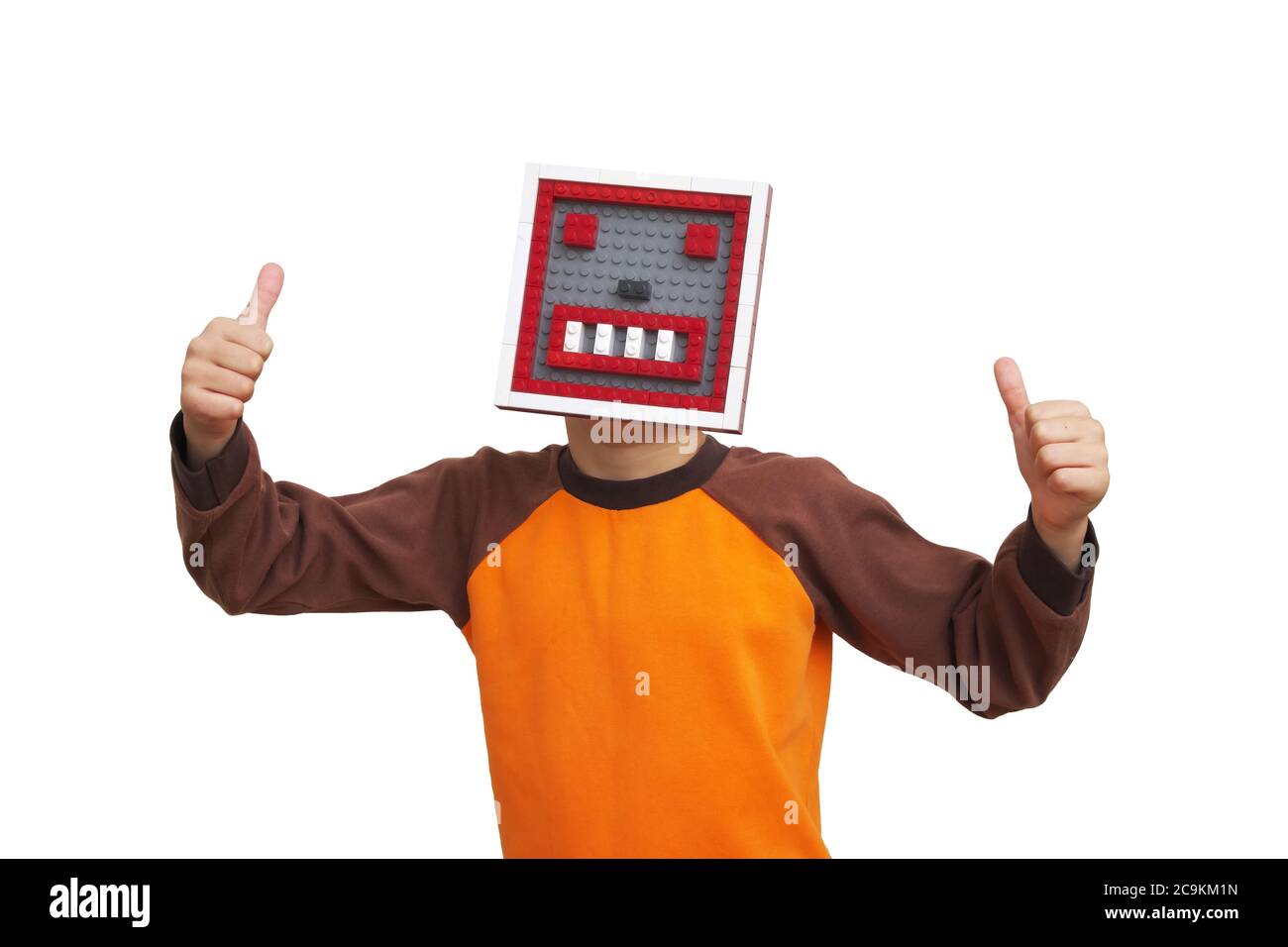 Portrait of little boy with robot head giving you thumbs up over ...
