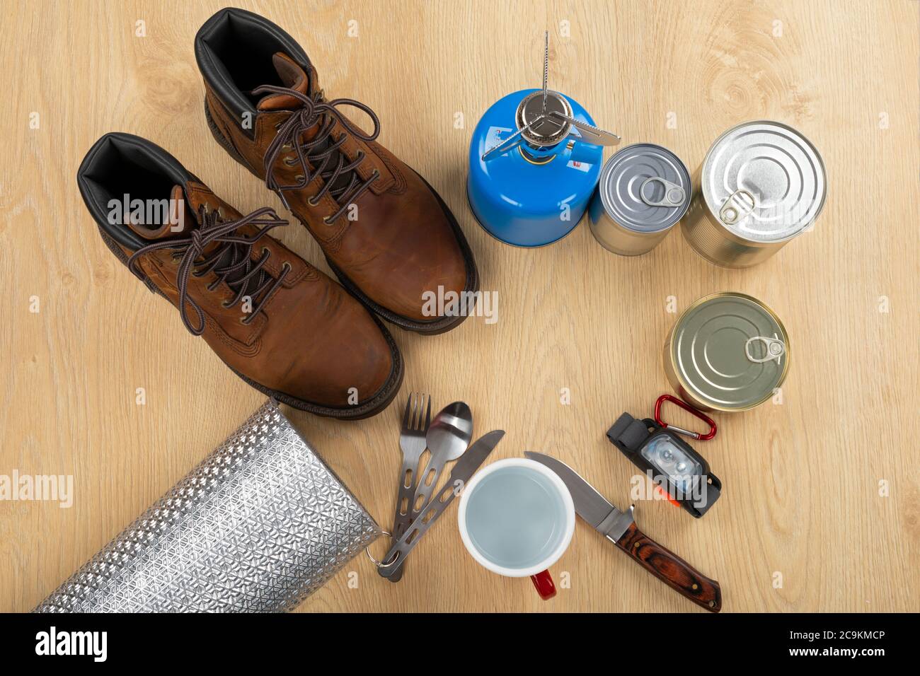 Picture of camping tools on a table - gas tank, cans, etc - ready to go ...