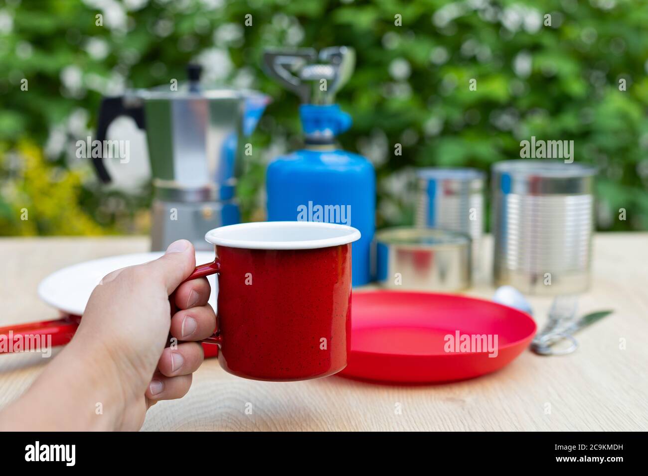 Picture of camping tools on a table - gas tank, cans, etc - ready to go ...