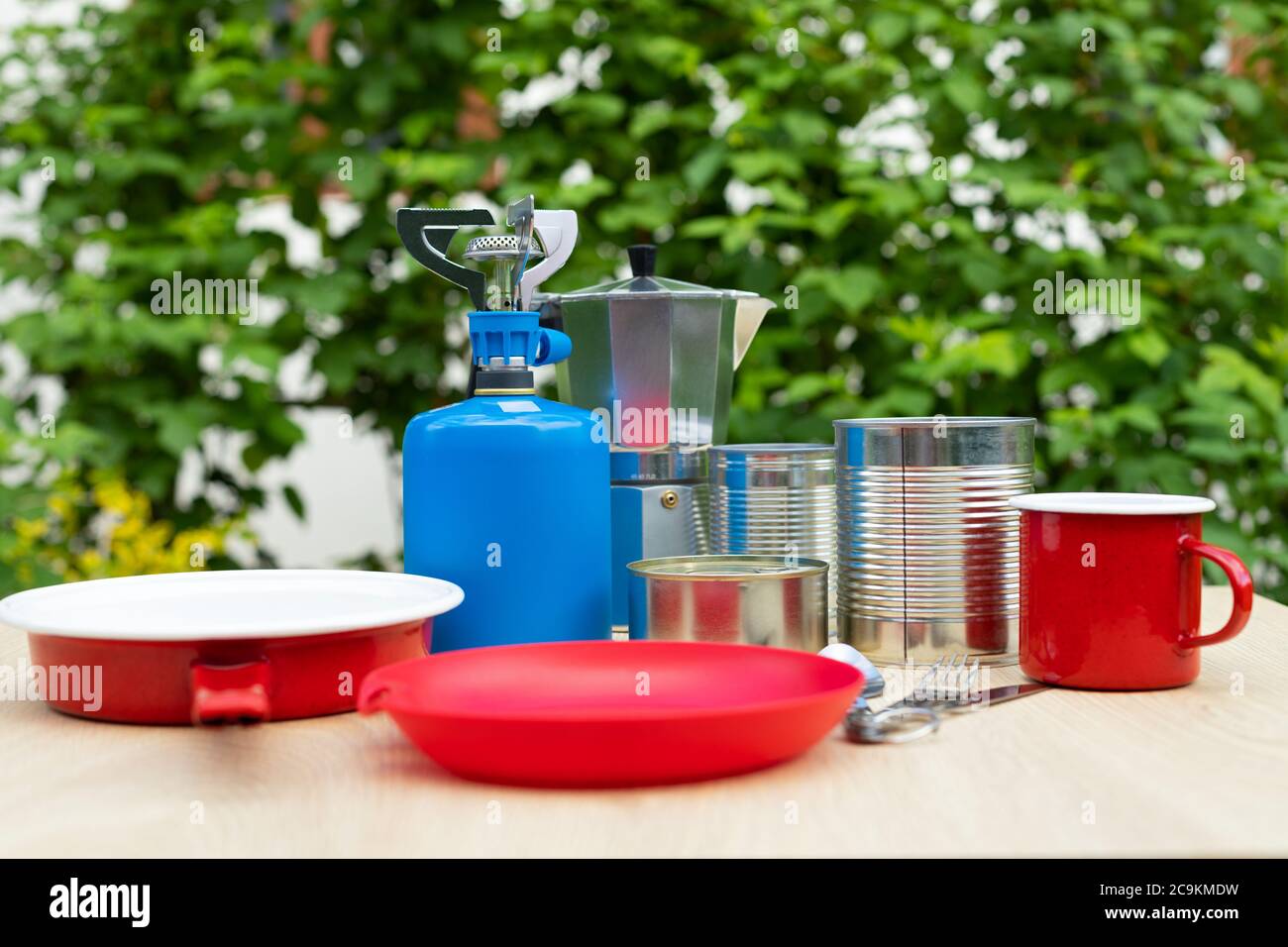 Picture of camping tools on a table - gas tank, cans, etc - ready to go ...
