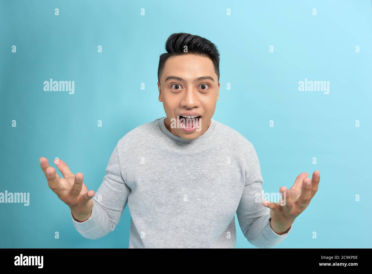 Excited businessman celebrating a win Stock Photo - Alamy