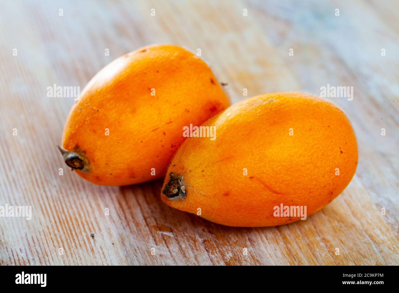 Ripe medlar fruits nispero on wooden surface, nobody Stock Photo - Alamy