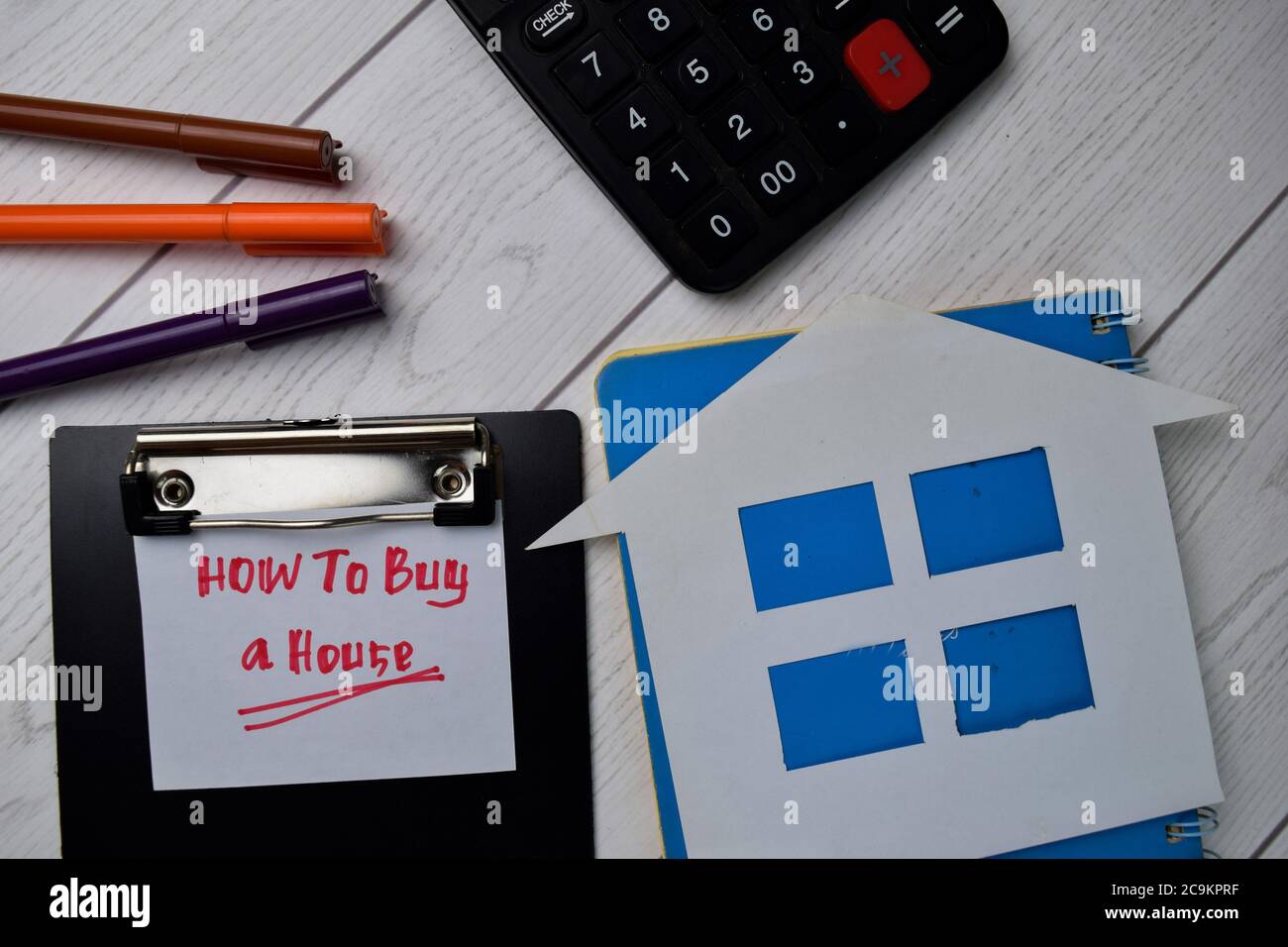 How To Buy a House text write on paperwork isolated on office desk ...