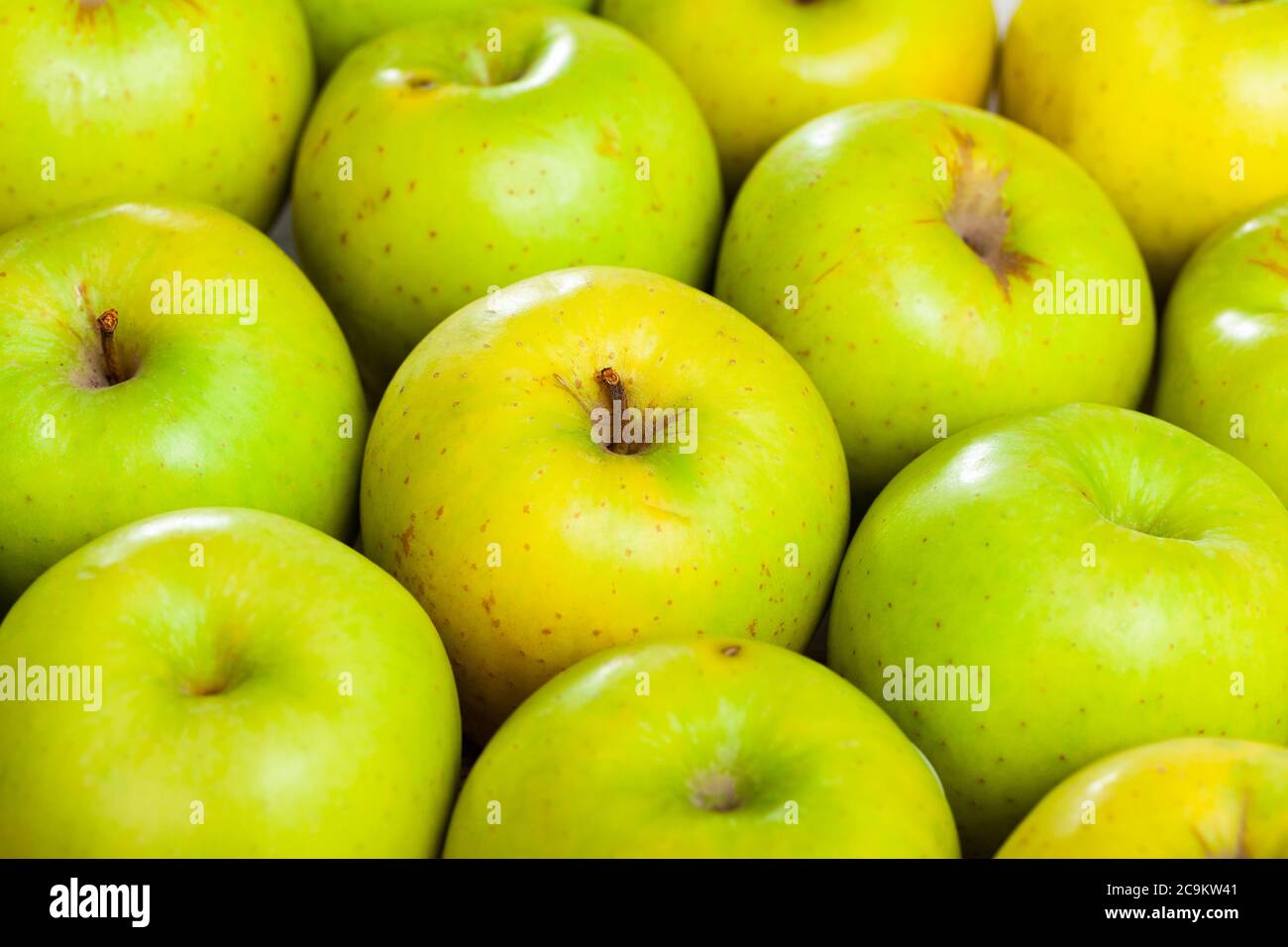 Fresh green and yellow apples on table Stock Photo - Alamy