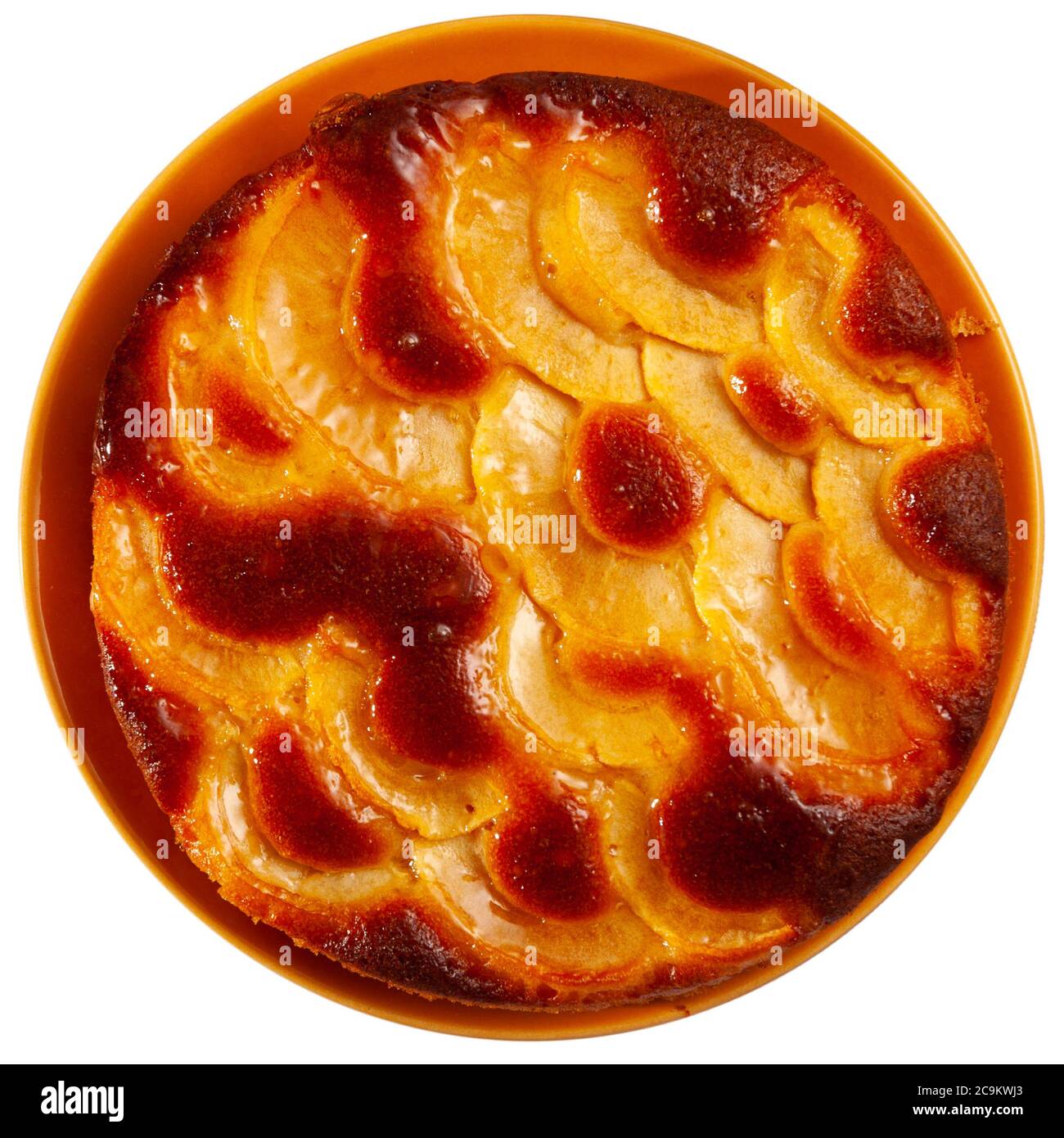 Freshly baked appetizing homemade sponge apple cake on ceramic plate ...