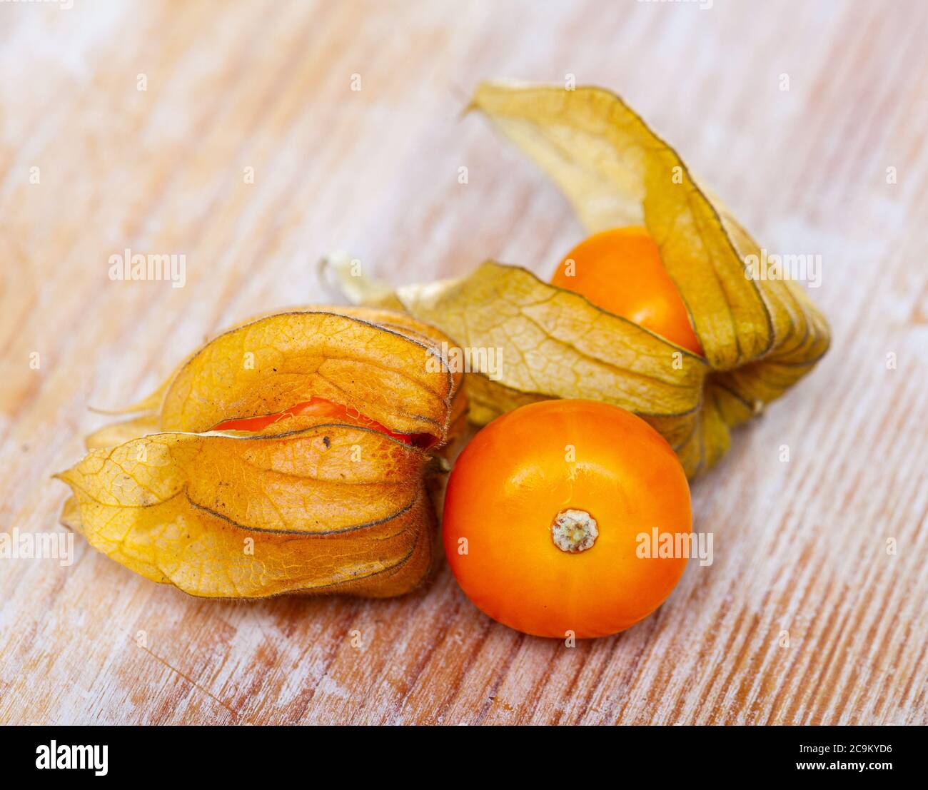 Ripe Peruvian physalis fruits on wooden surface. Concept of health ...