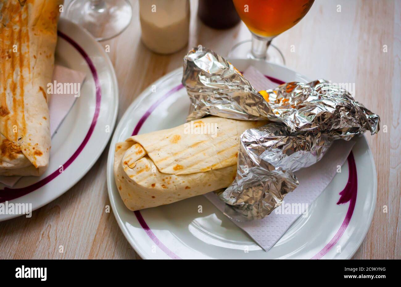 Traditional turkish Durum with meat, vegetables and sauce in lavash ...