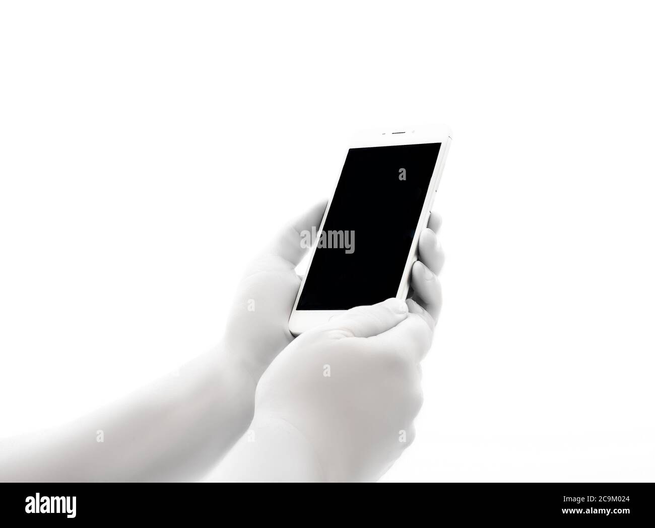 Human bionic hands holding electronic device on white background ...