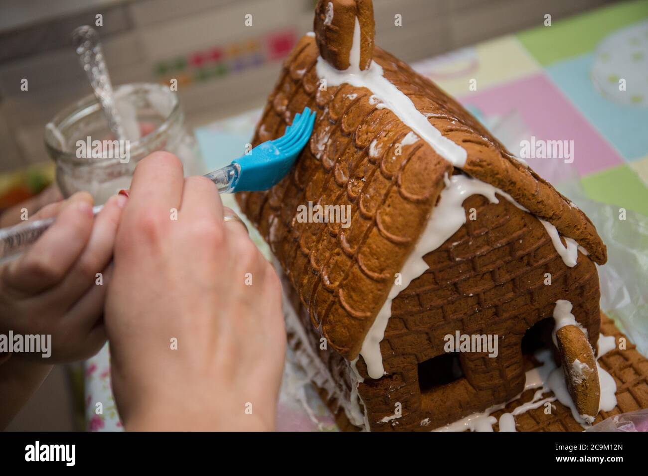 making a gingerbread house on kitchen table Stock Photo - Alamy