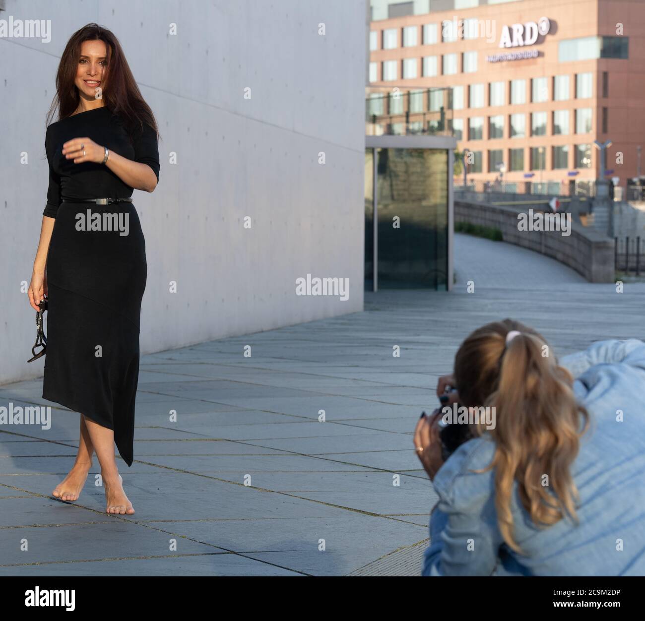 Berlin, Germany. 01st Aug, 2020. Model Evgenia (l) is photographed in ...