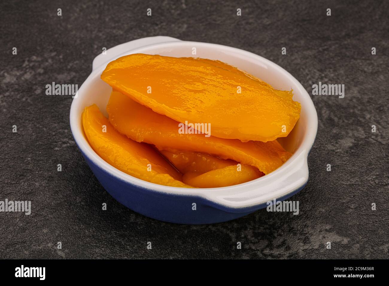 Sweet delicous mango slices in syrop Stock Photo - Alamy