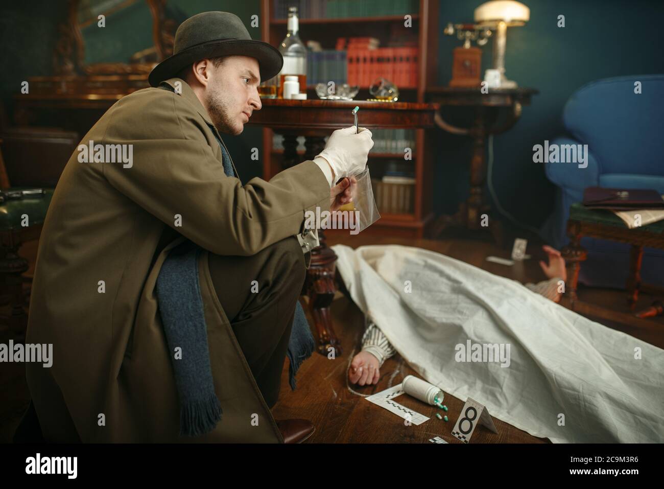Male detective with takes search evidence Stock Photo - Alamy