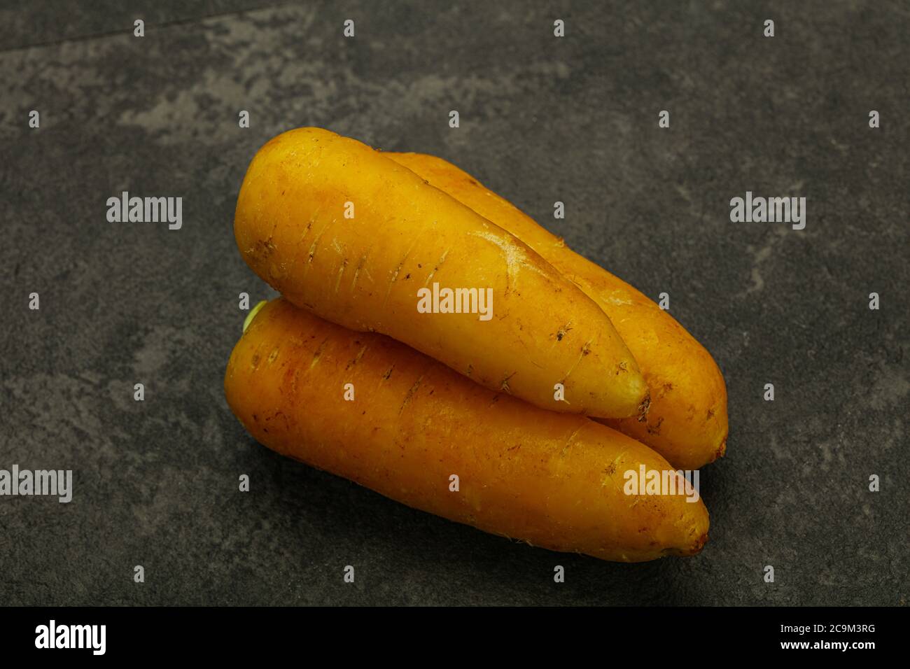 Natural vegan food - Raw Yellow carrot Stock Photo - Alamy