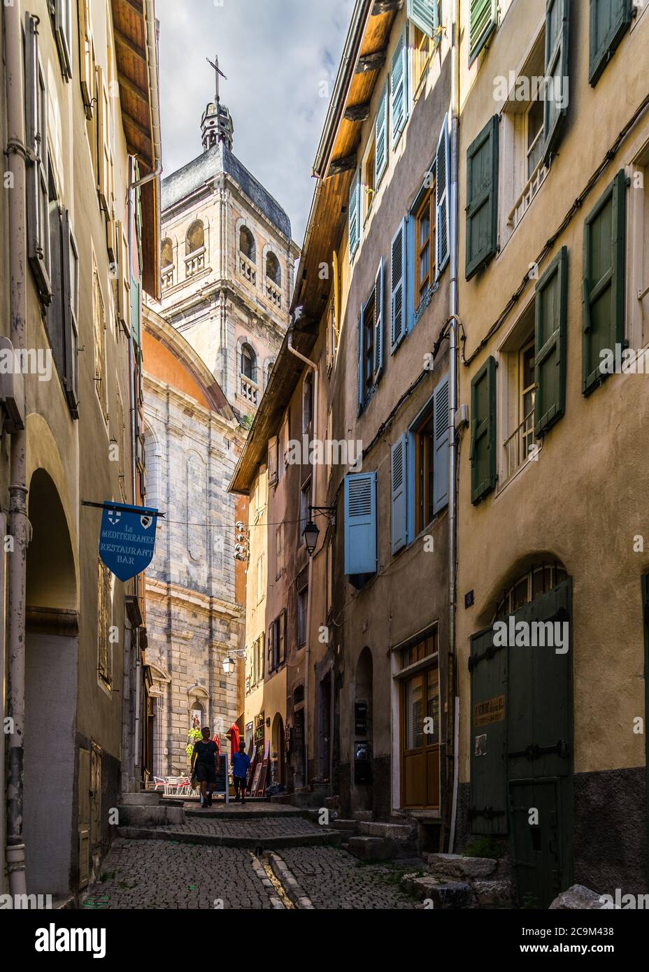 A narrow alley in Briancon old town leading to the The Collegiate ...