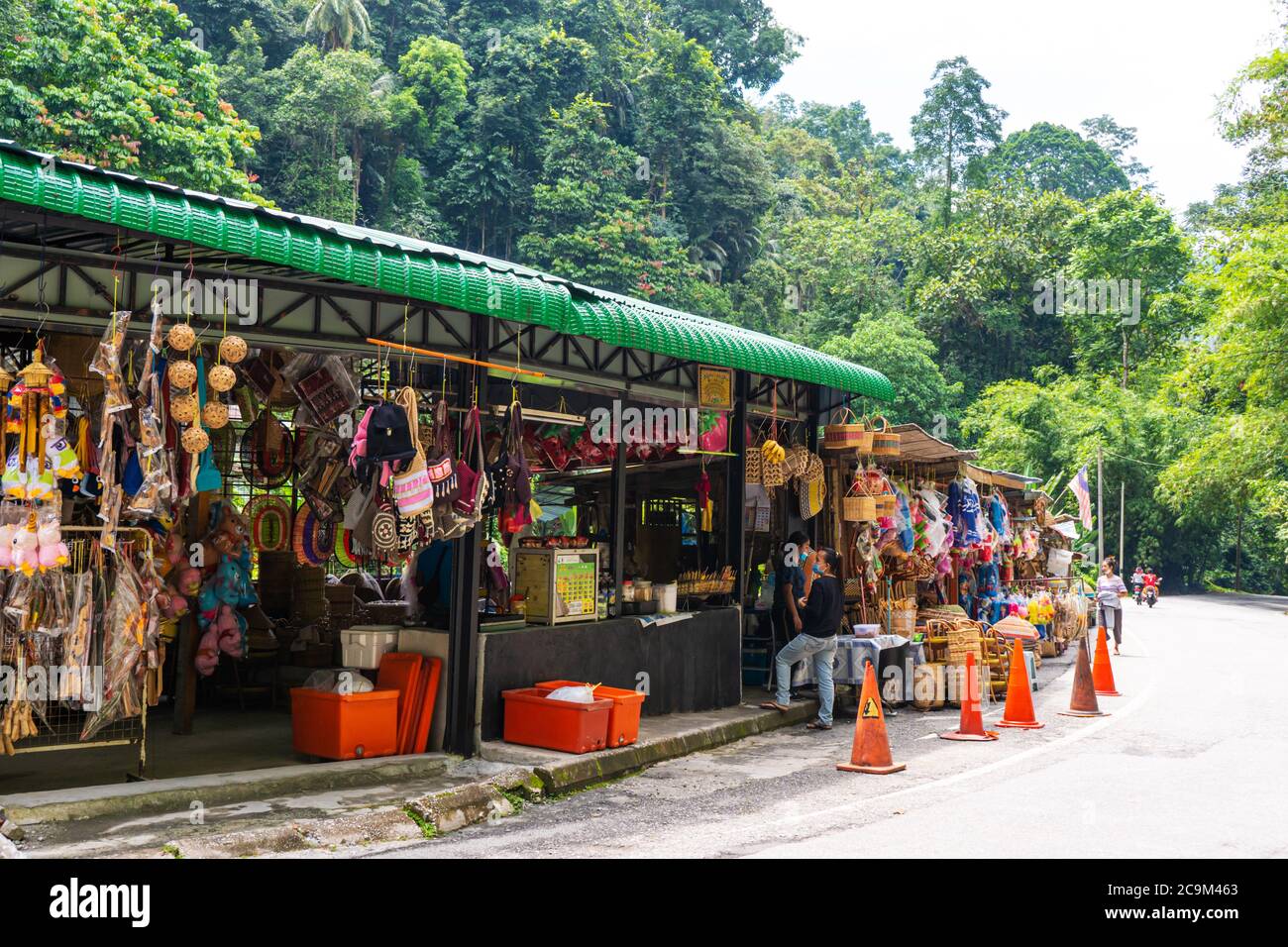 Asian street shops selling souvenirs and trinkets along the road Stock ...