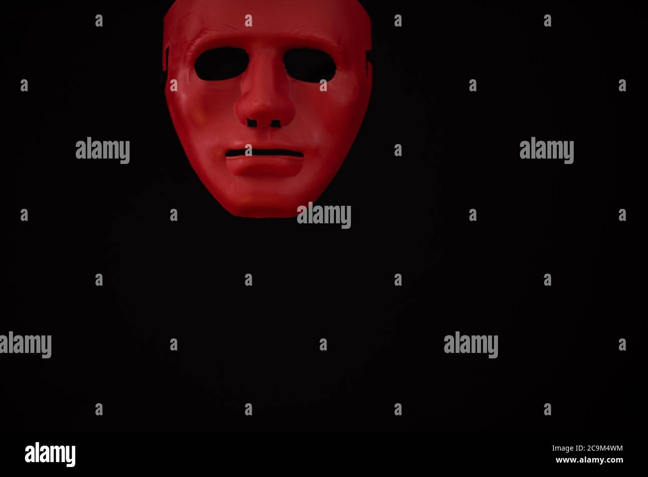 Mask isolated in dark room Stock Photo - Alamy