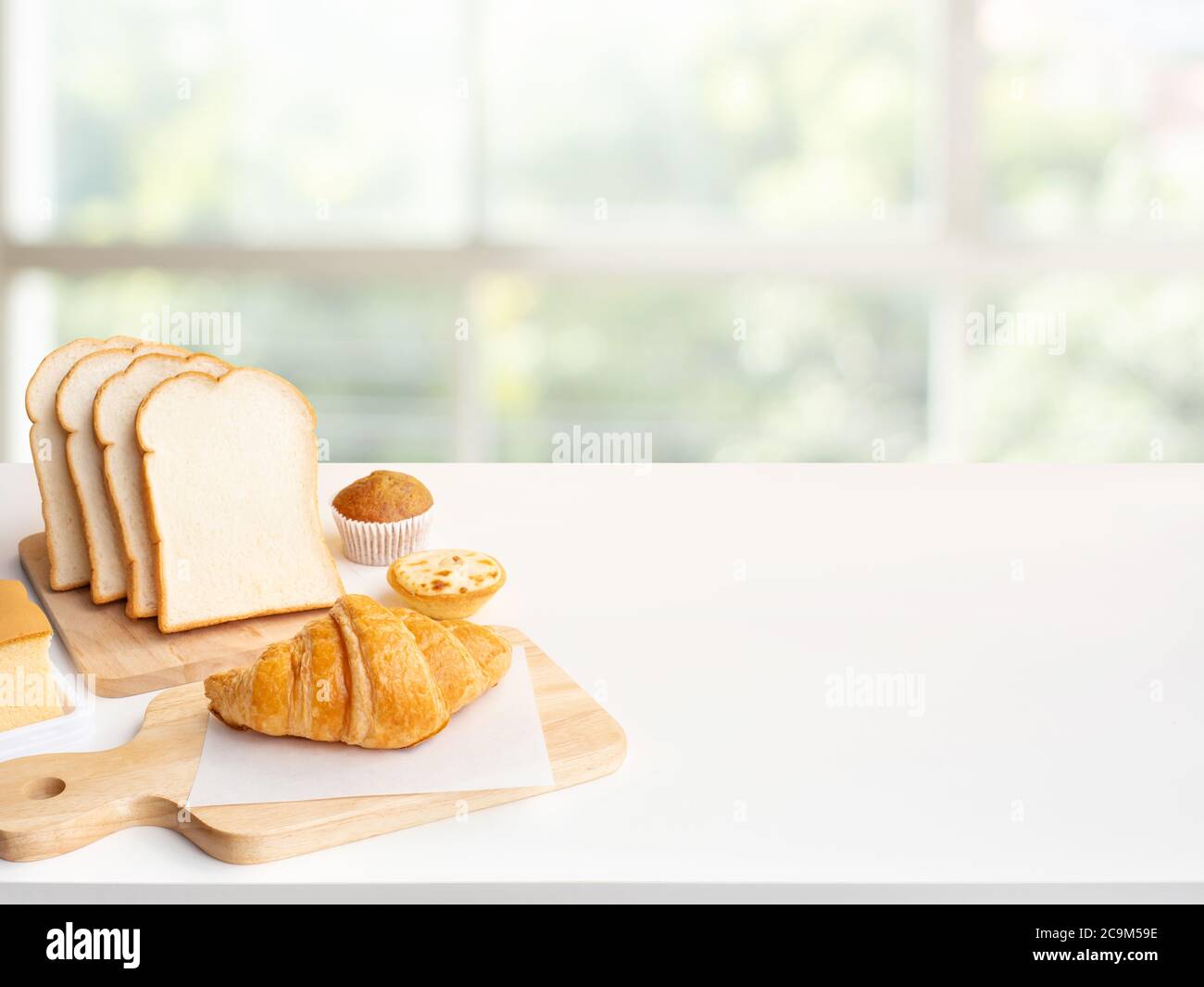 Set of breakfast food or bakery,cake on table kitchen with window ...