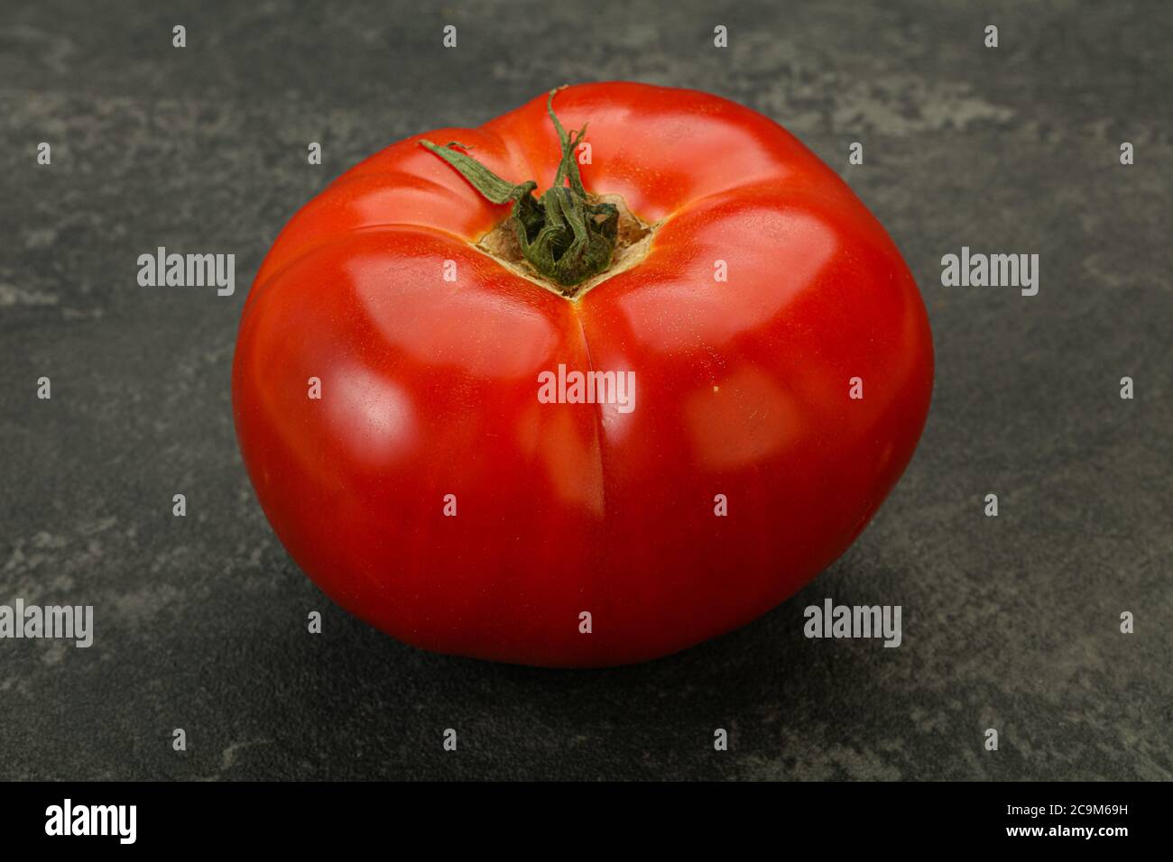 Ripe big juicy red tomato for cooking Stock Photo - Alamy