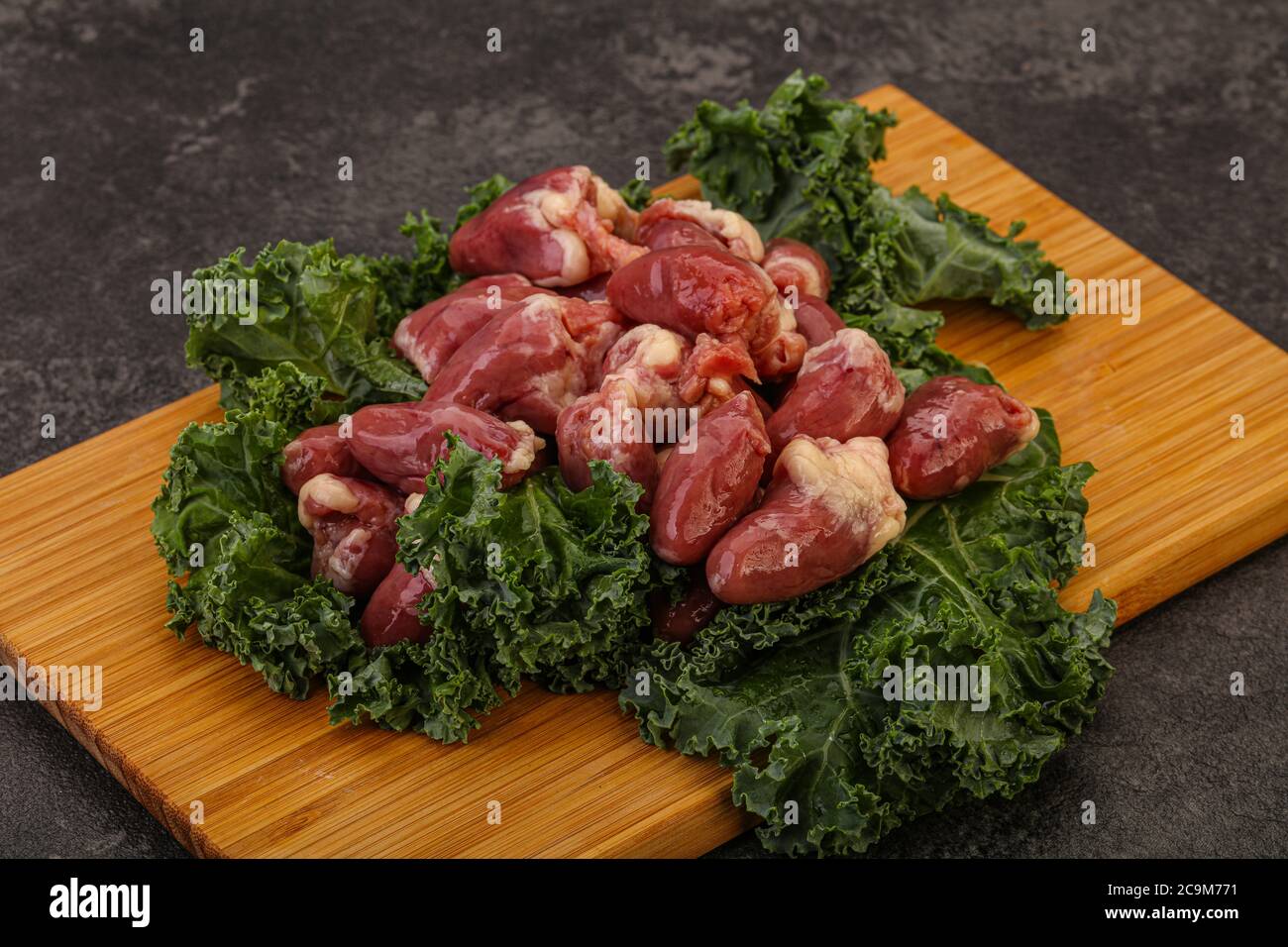 Raw chicken hearts heap for cooking Stock Photo - Alamy