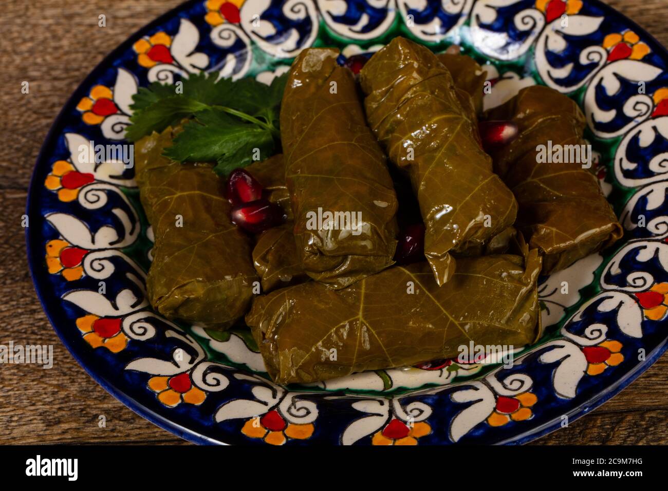 Caucasian traditional Dolma - minced meat in grape leaves Stock Photo ...