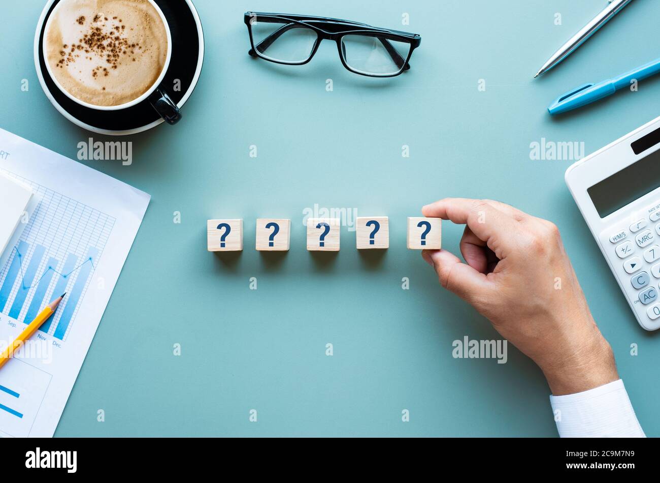 Question and answer concepts with business person and sign on desk ...