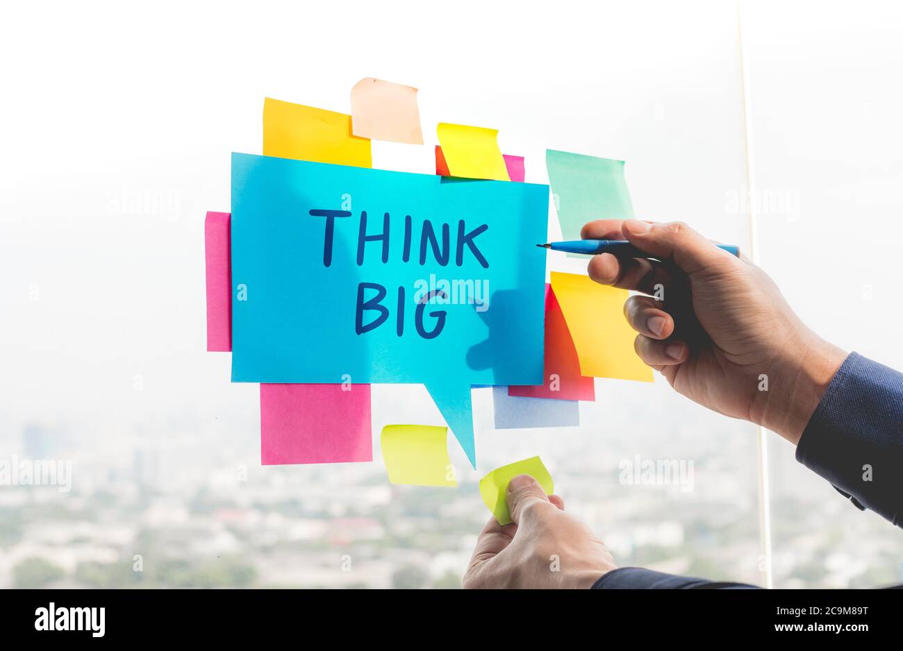 Think big and creativity concepts with male showing bubble paper with ...