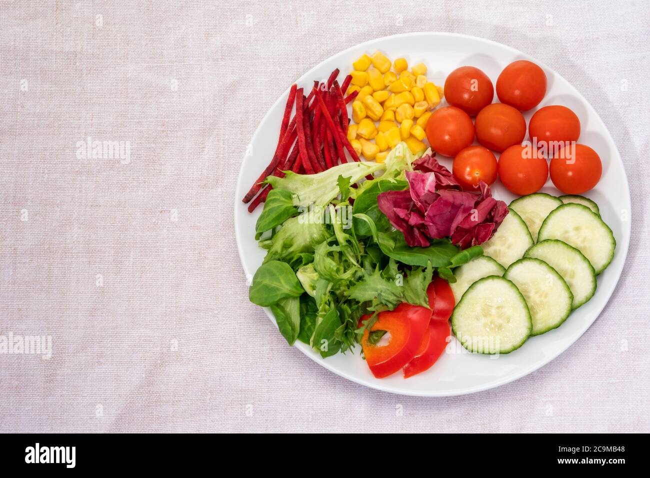 Salad items on a plate - diet food Stock Photo - Alamy