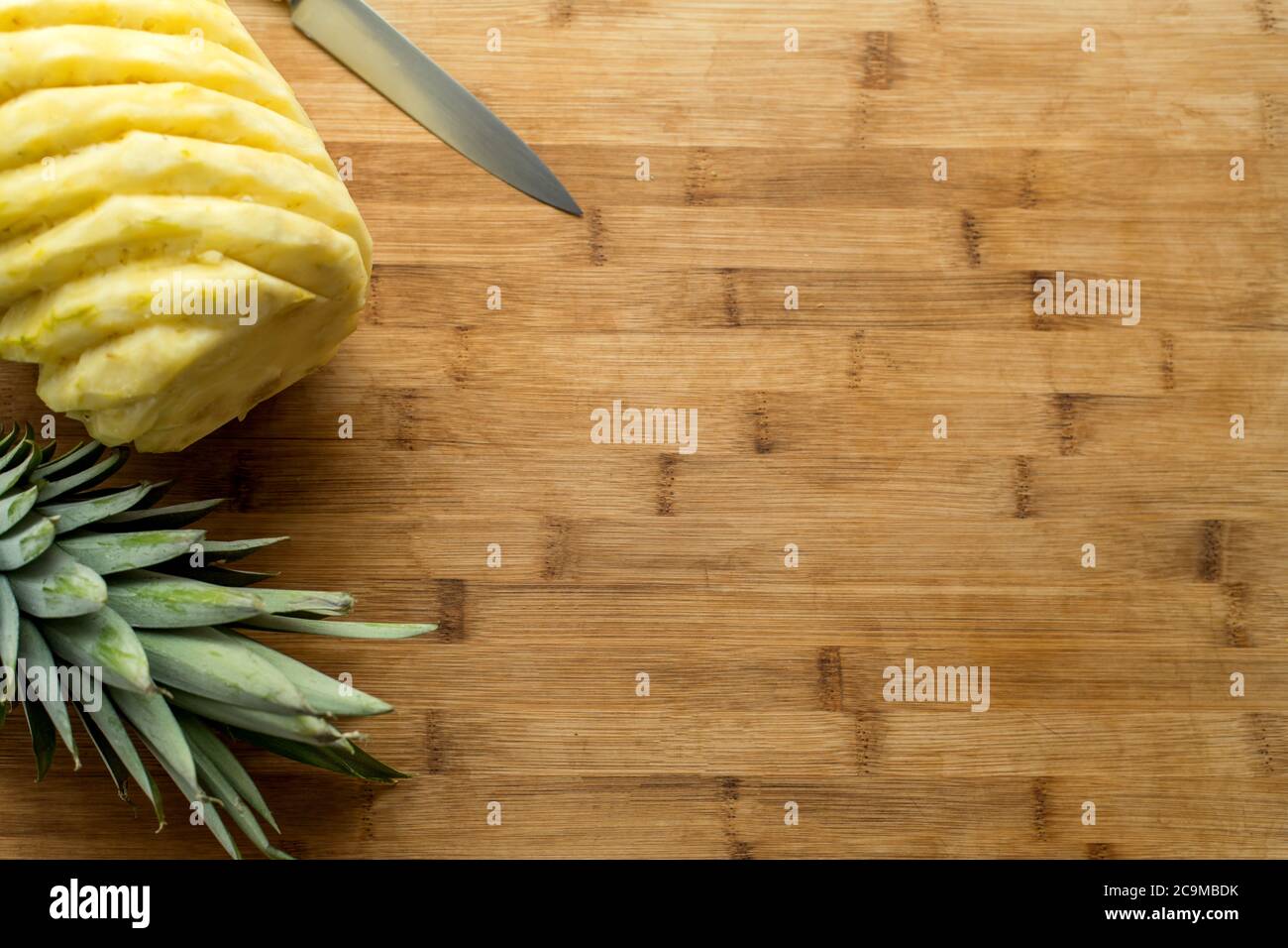Ripe perfectly peeled pineapple, on a wooden background Stock Photo - Alamy