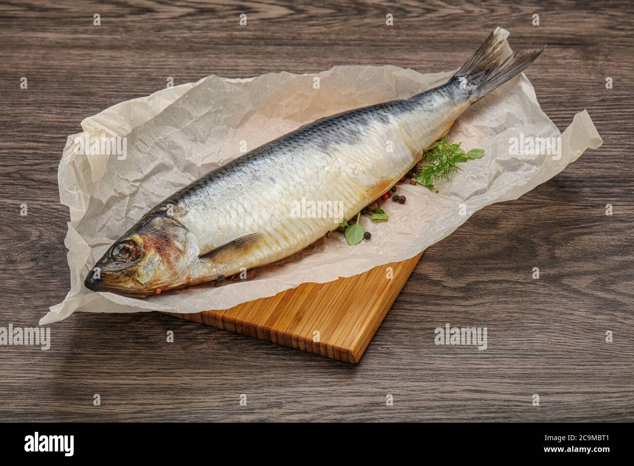 Salted Herring fish with pepper and spices Stock Photo - Alamy