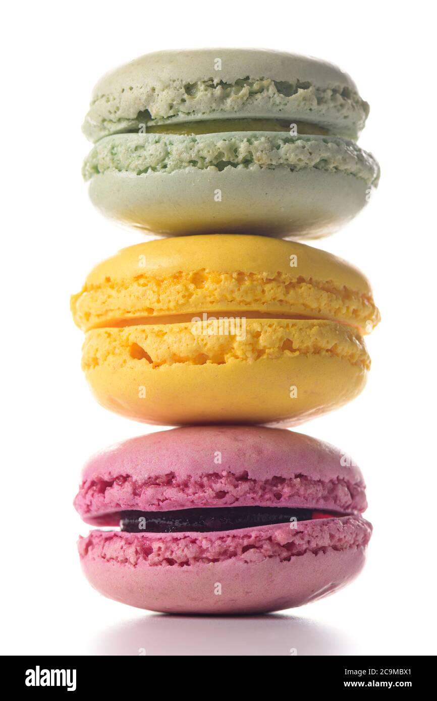 Three macaroons standing on top of each other on white background Stock ...