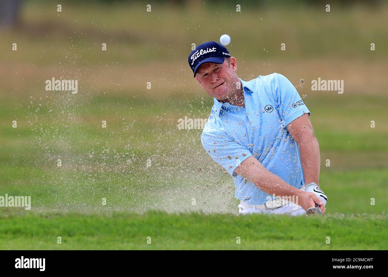 Wales' Jamie Donaldson chips out of a bunker on the 7th during day ...