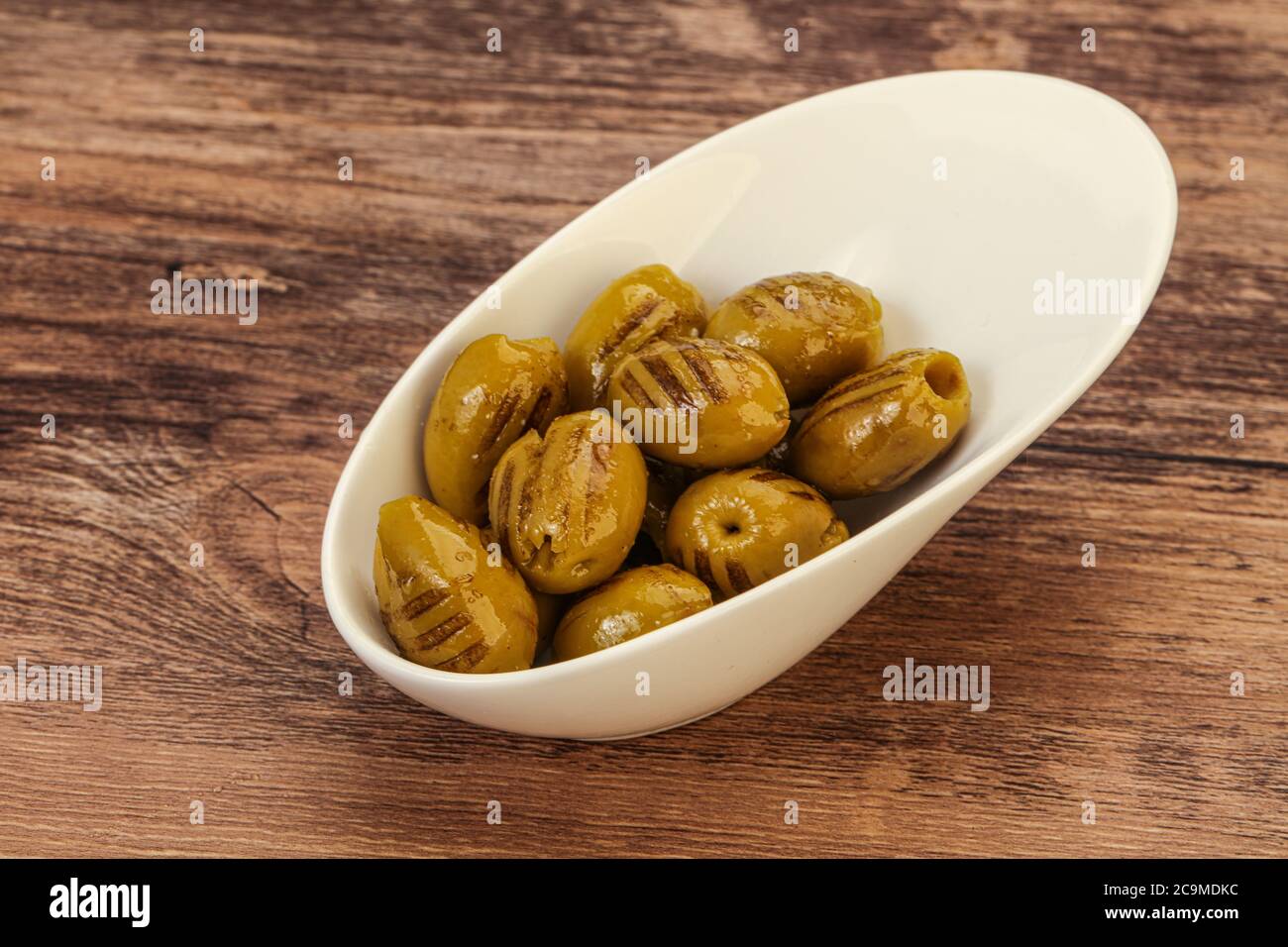 Tasty Green grilled olives in the bowl Stock Photo - Alamy