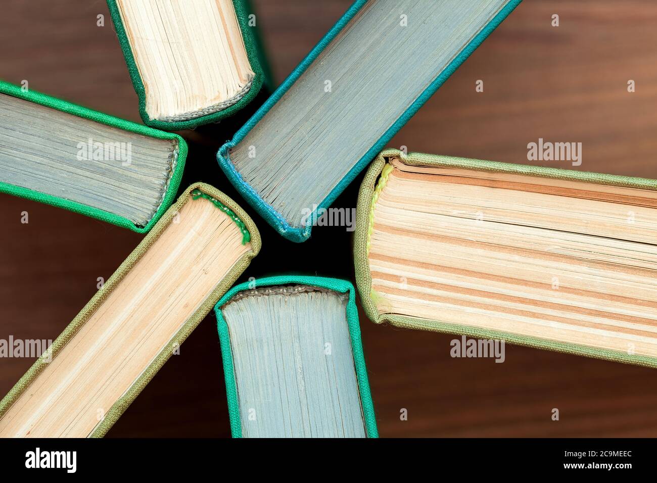 used hardback books or text books seen from above on wooden table Stock ...