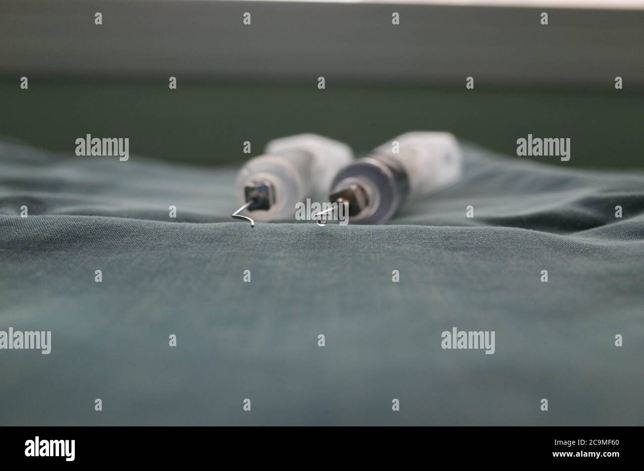 macro photo of water drop on the tip of needle Stock Photo - Alamy