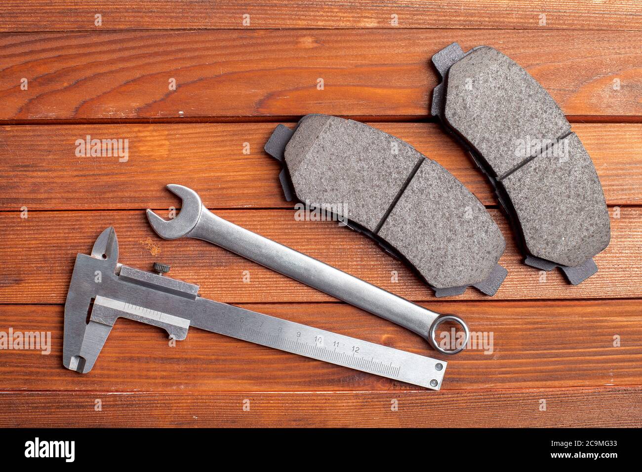 The tool for replacement of brake pads: a spanner wrench, a caliper and ...