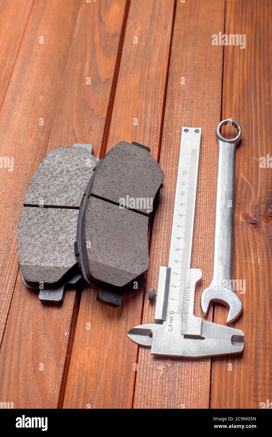 The tool for replacement of brake pads: a spanner wrench, a caliper and ...