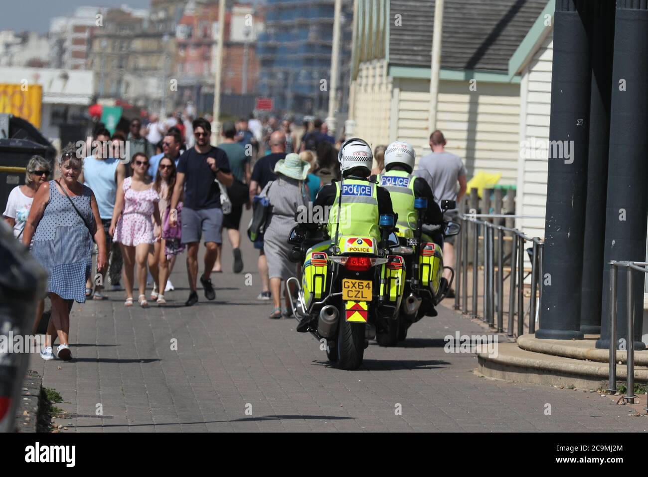 People enjoy the hot weather on Brighton beach in Sussex, as police ...