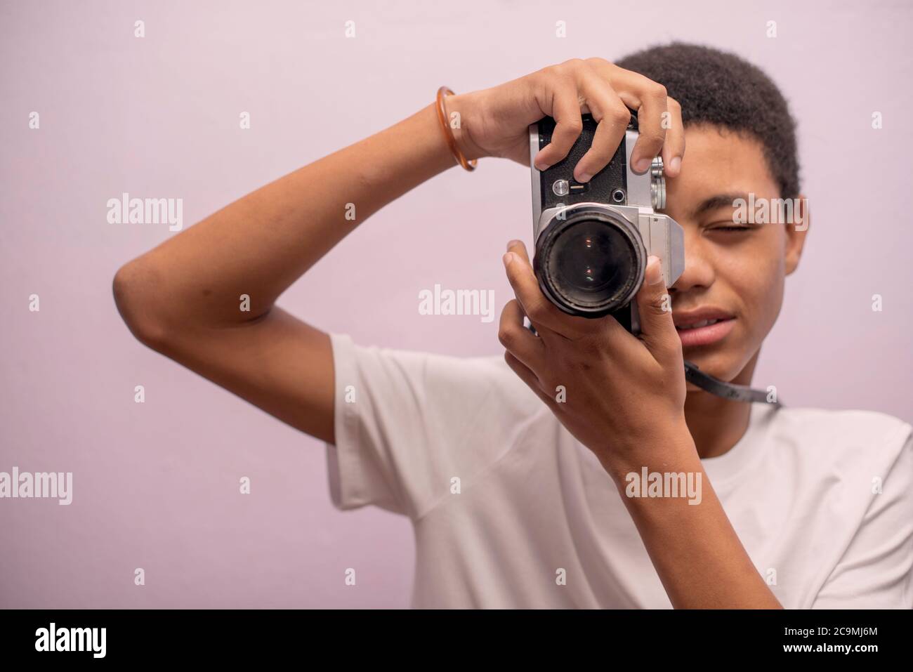 Portrait of teenager using camera Stock Photo - Alamy