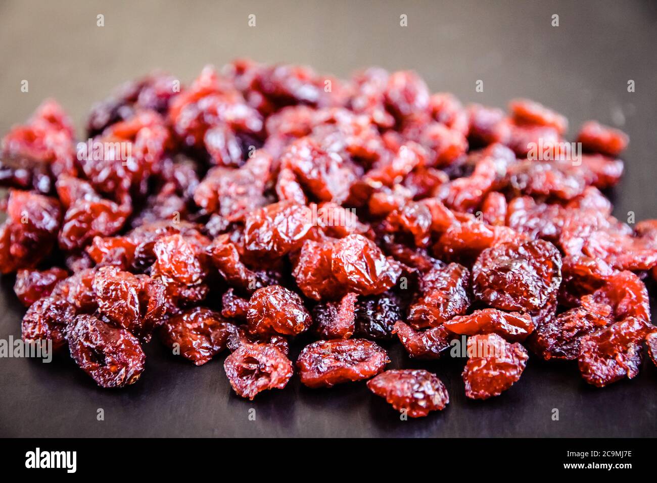 Dried bunch of organic cranberries on a kitchen table Stock Photo - Alamy