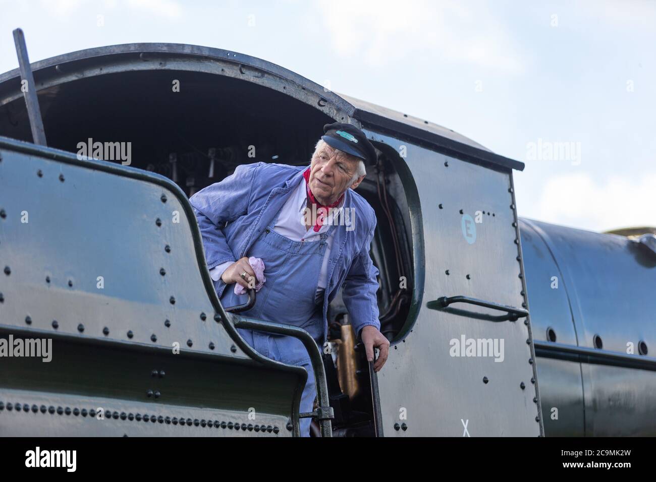 Train driver in a steam engine, Severn Valley Railway, UK Stock Photo ...