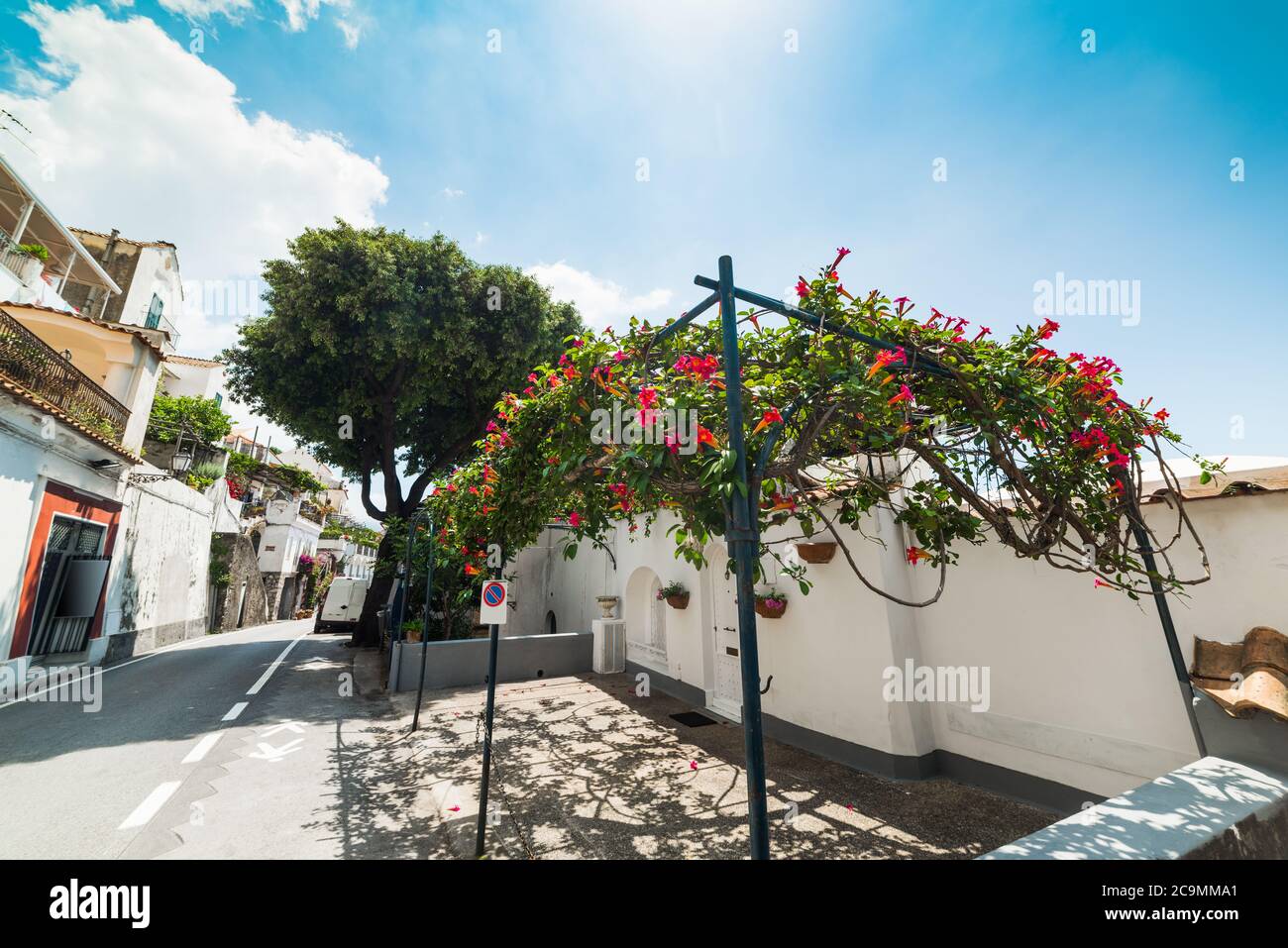 Arbor with red flowers in world famous Positano. Amalfi coast, Italy ...