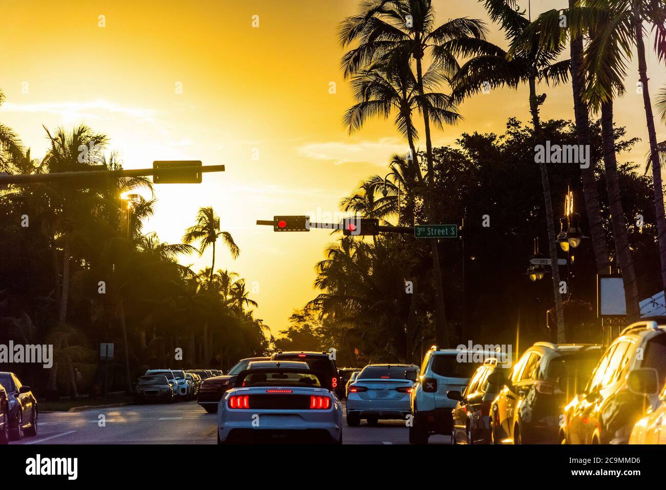 Driving in Naples under a shining sun at sunset. Florida, USA Stock ...