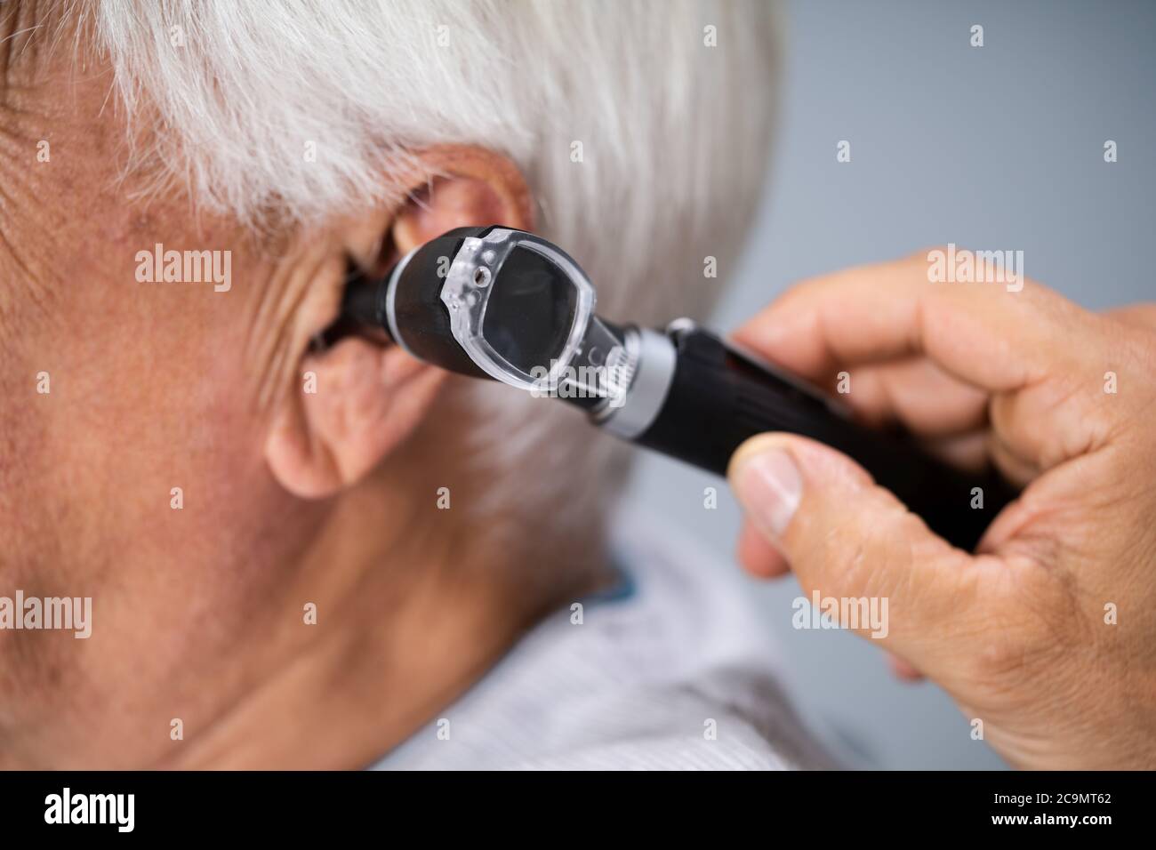 Otolaryngology Check. Doctor Checking Ear Using Otoscope Stock Photo ...