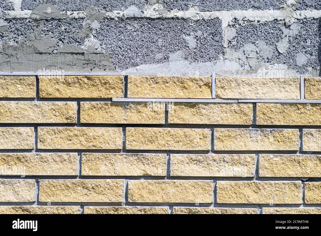 Wall cladding with decorative bricks, front view. Material for ...