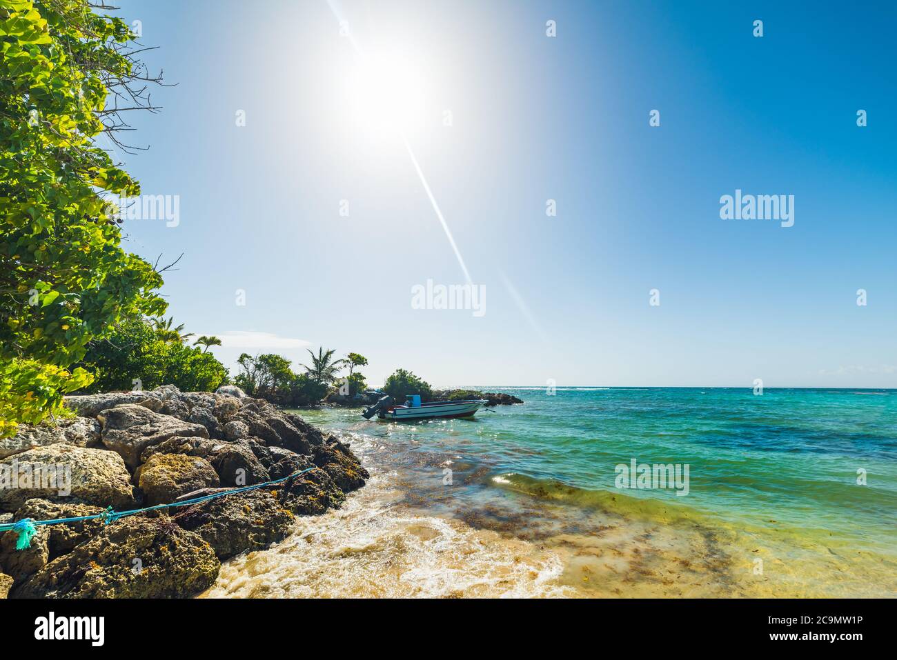 Small boat moored in Raisins Clairs beach in Guadeloupe, French west ...